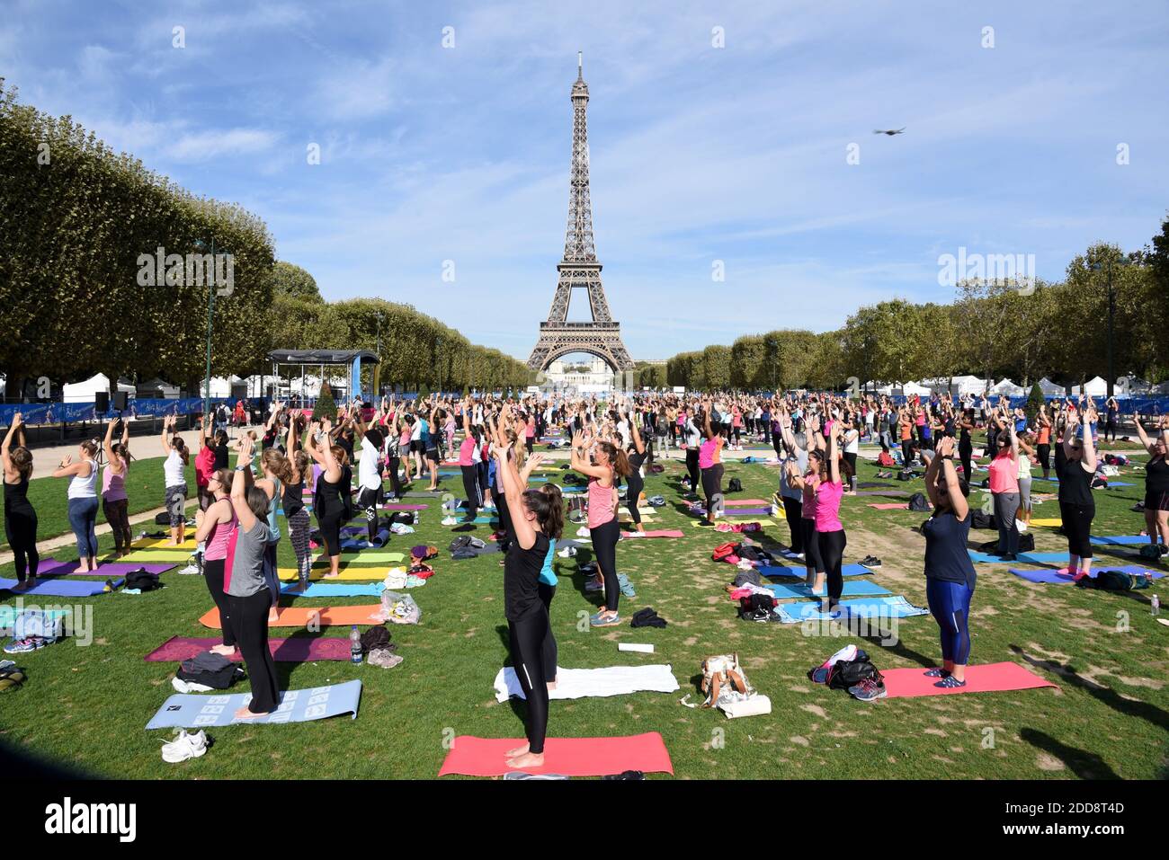 People practice yoga as part of the (La Parisienne) event in front of ...