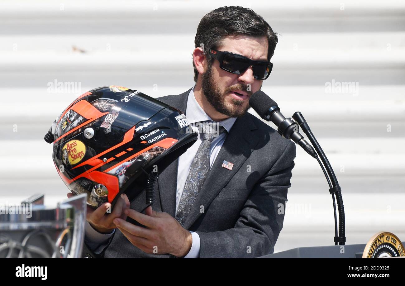 U.S. President Donald Trump is presented with a replica helmet from ...