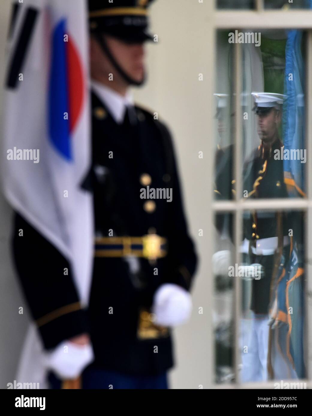 Honor guard carries a South Korean flag upon the arrival of President ...
