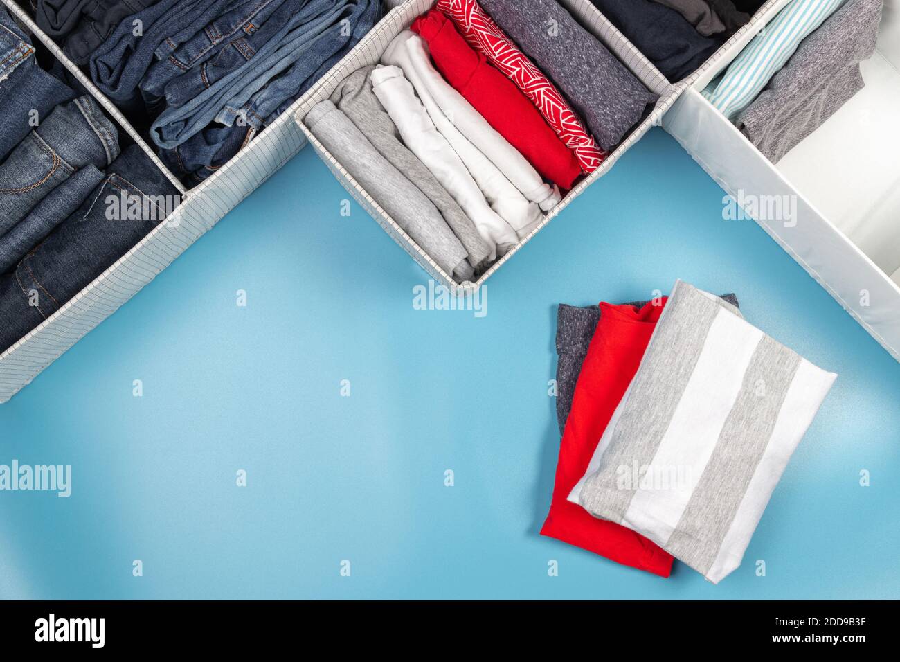 Vertical storage of clothing, tidying up, room cleaning concept. Stack ...