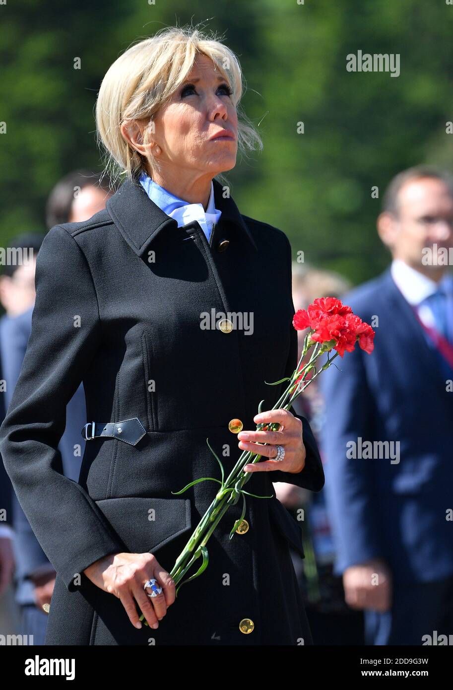 First Lady Brigitte Macron take part in a ceremony to lay flowers at ...