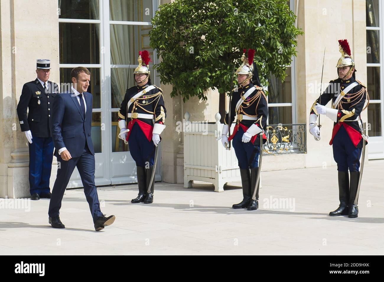 French President Emmanuel Macron arrives in the garden at the Elysee ...