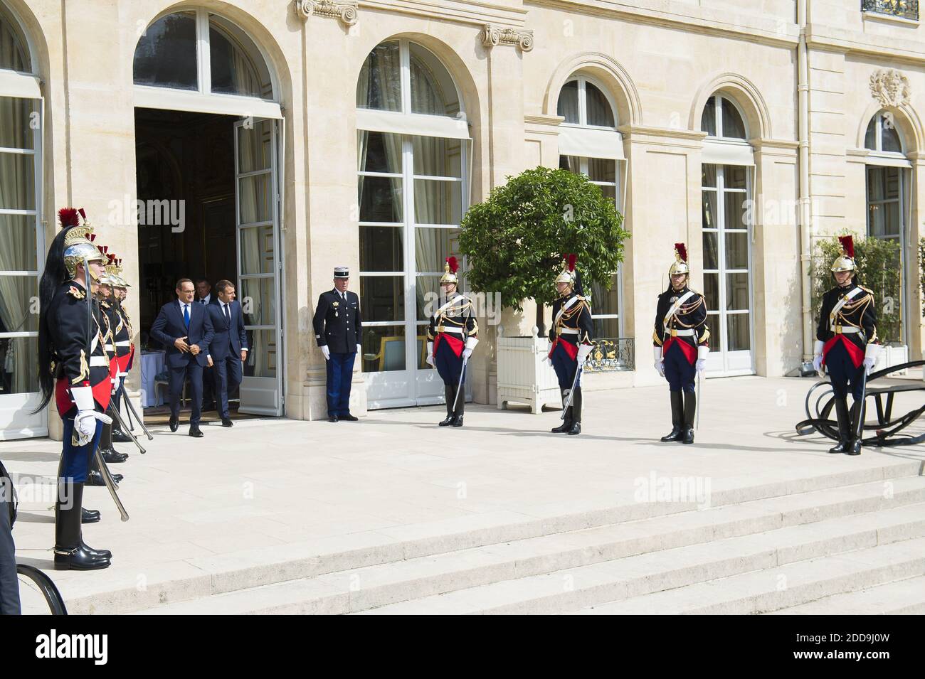 French President Emmanuel Macron arrives in the garden at the Elysee ...
