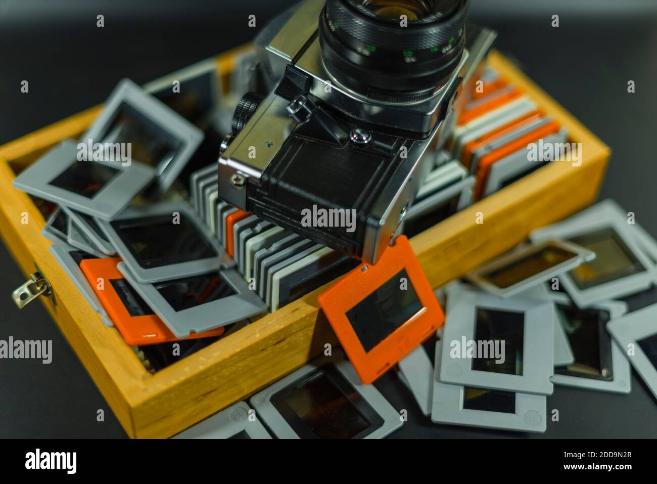 35mm Slide-Photos, An old analog camera and a wooden box with slides ...