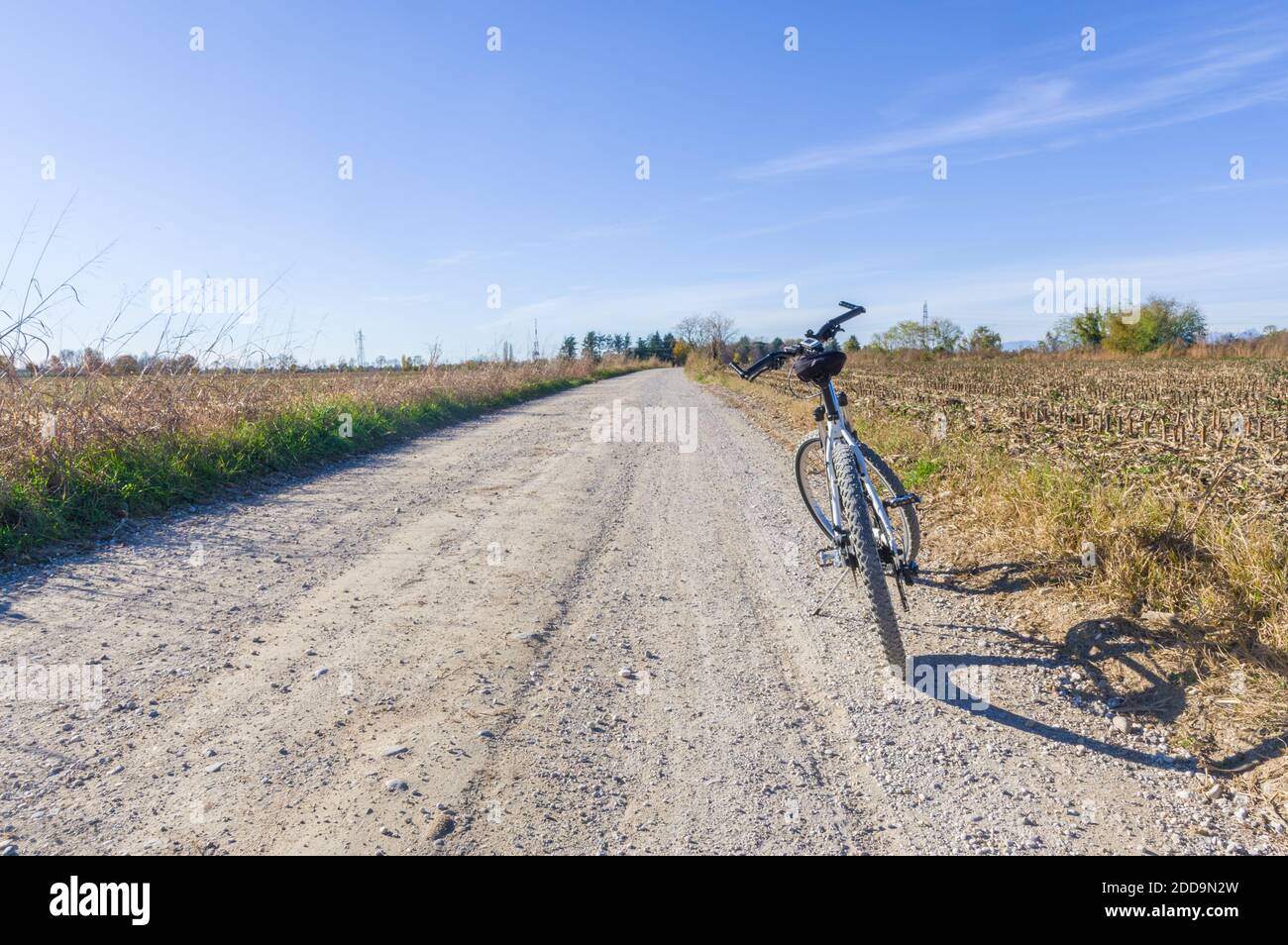 A dirt cycle path among the fields in the countryside of Northern Italy ...
