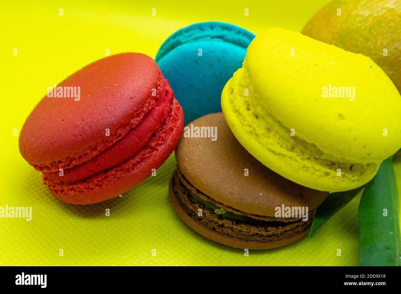 Set of colorful French macaroni. Sweet almond cookies with different ...