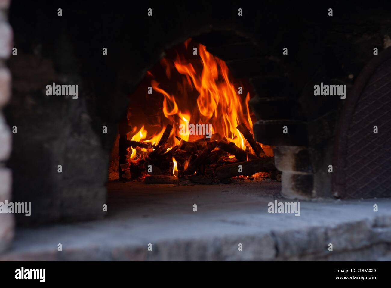 Fire in a wood-fired oven Stock Photo - Alamy