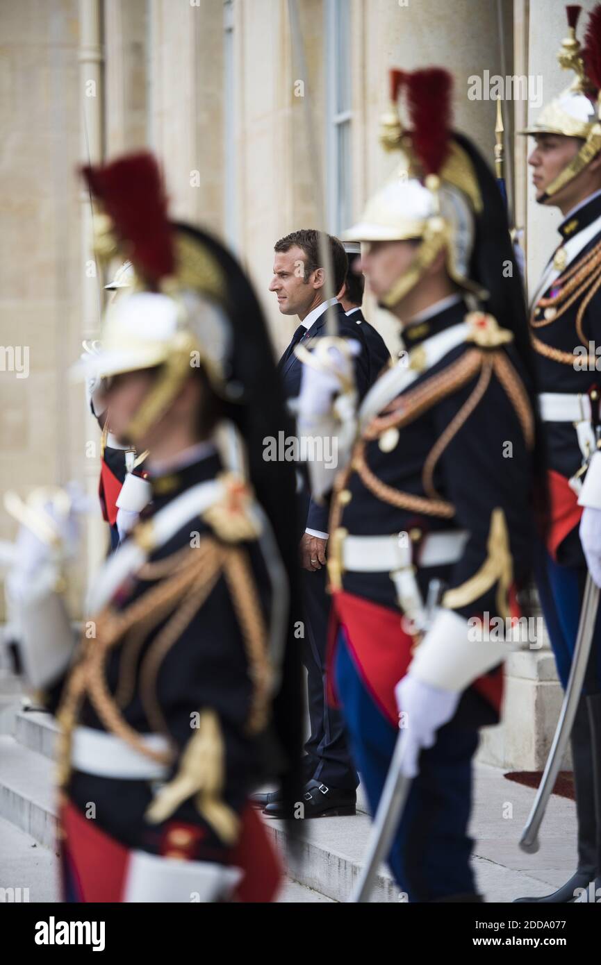 Surrounded by Republican Guards, French president Emmanuel Macron ...