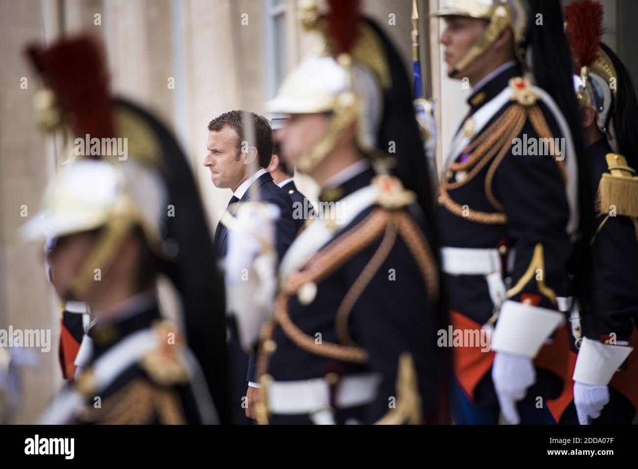 Surrounded by Republican Guards, French president Emmanuel Macron ...