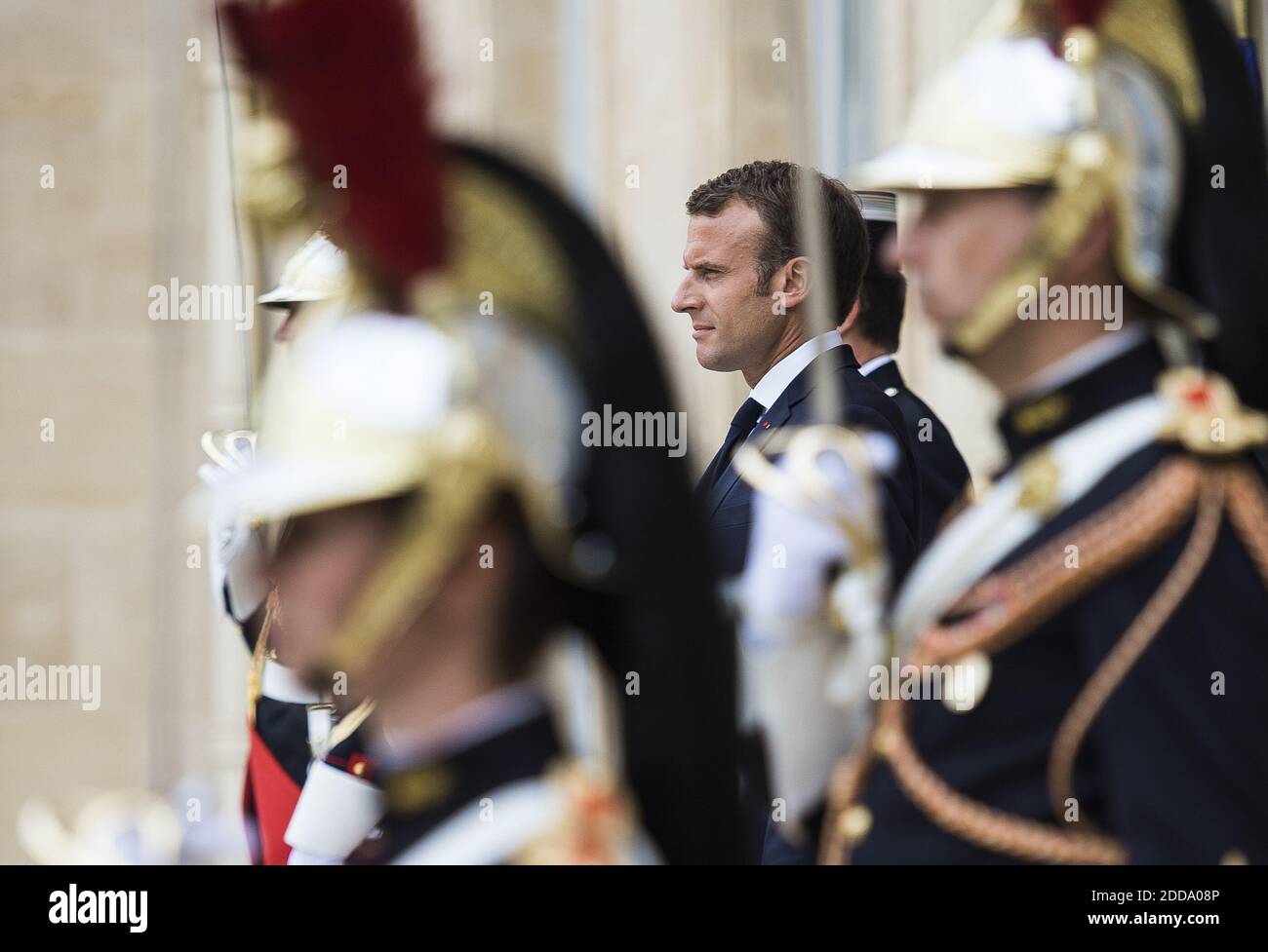 Surrounded by Republican Guards, French president Emmanuel Macron ...