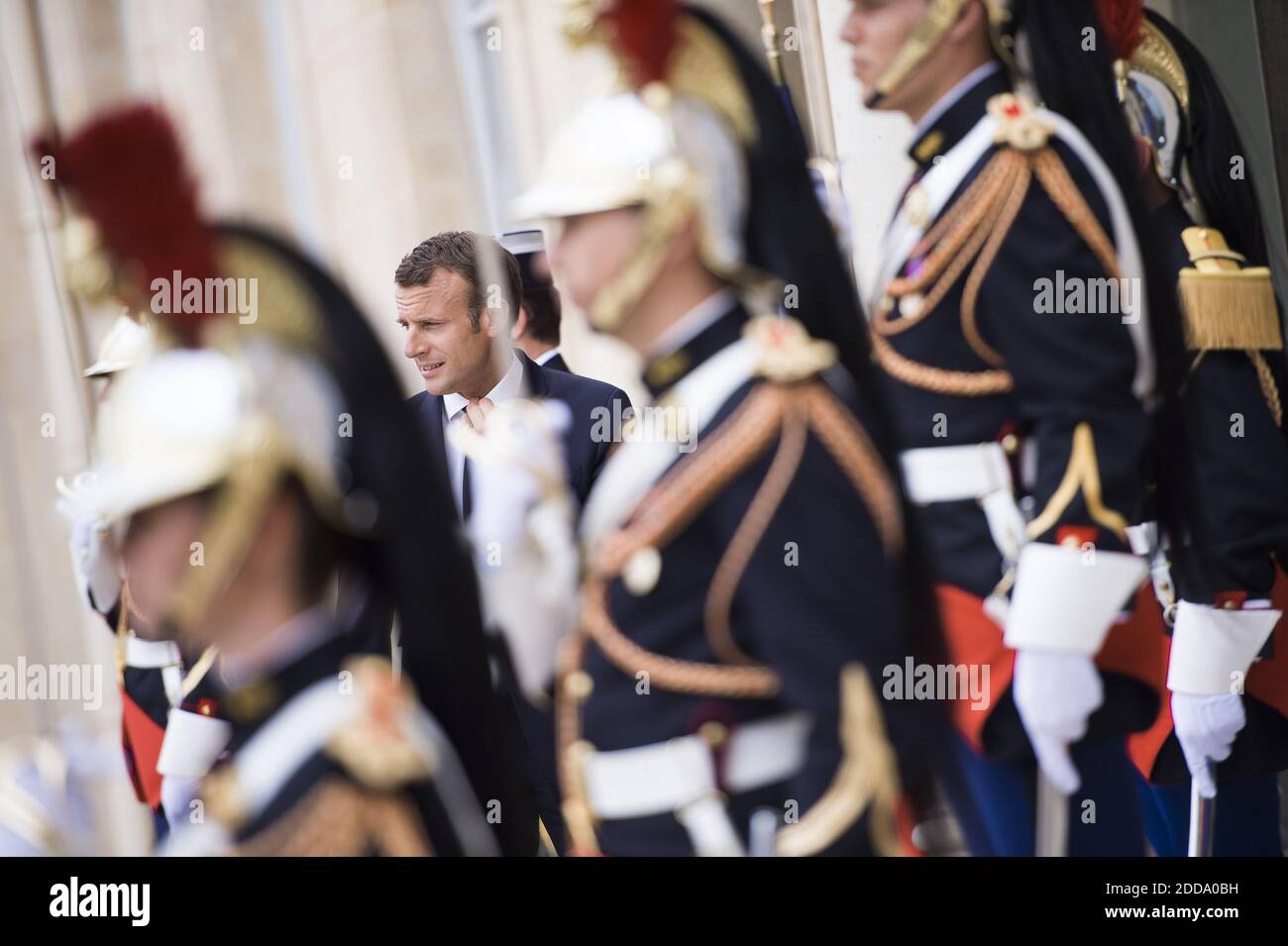 Surrounded by Republican Guards, French president Emmanuel Macron ...
