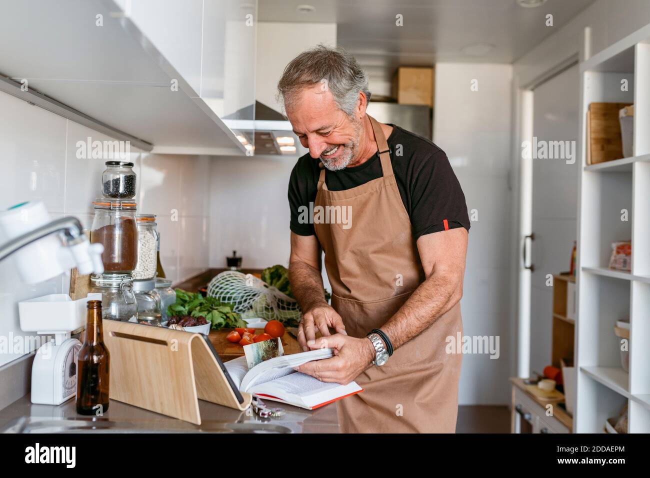 Man reading cook book hi-res stock photography and images - Alamy
