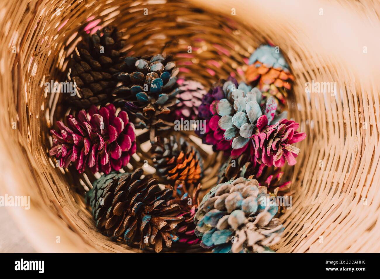Colorful pine cones in wicker basket at park Stock Photo - Alamy
