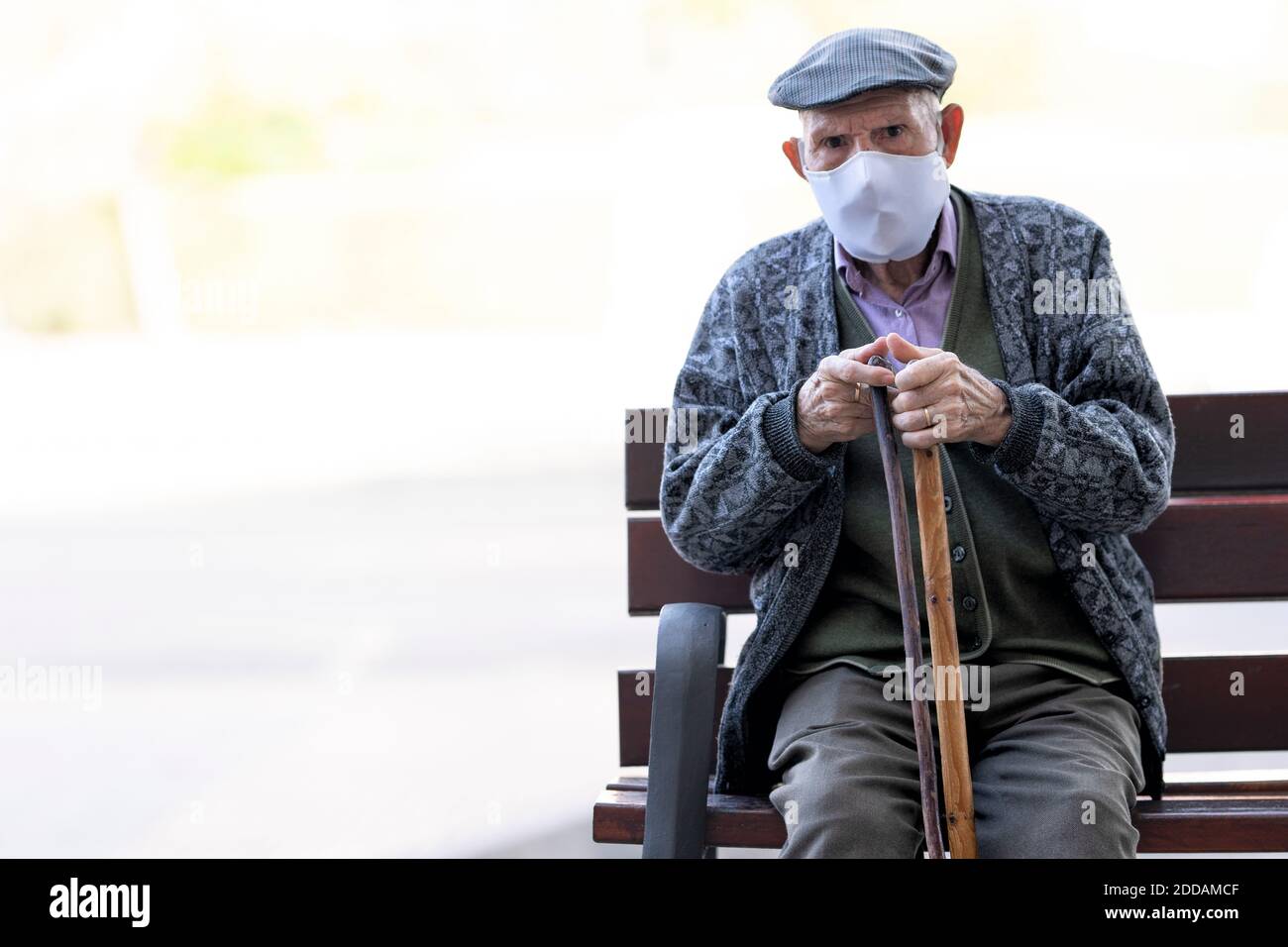 Man mask sitting on bench hi-res stock photography and images - Alamy