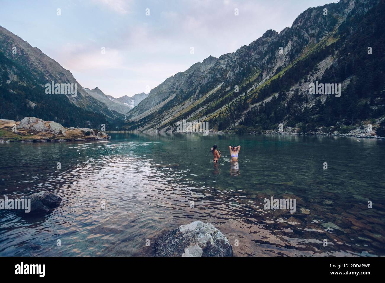 Young women taking bath in lake of Gaube Stock Photo - Alamy