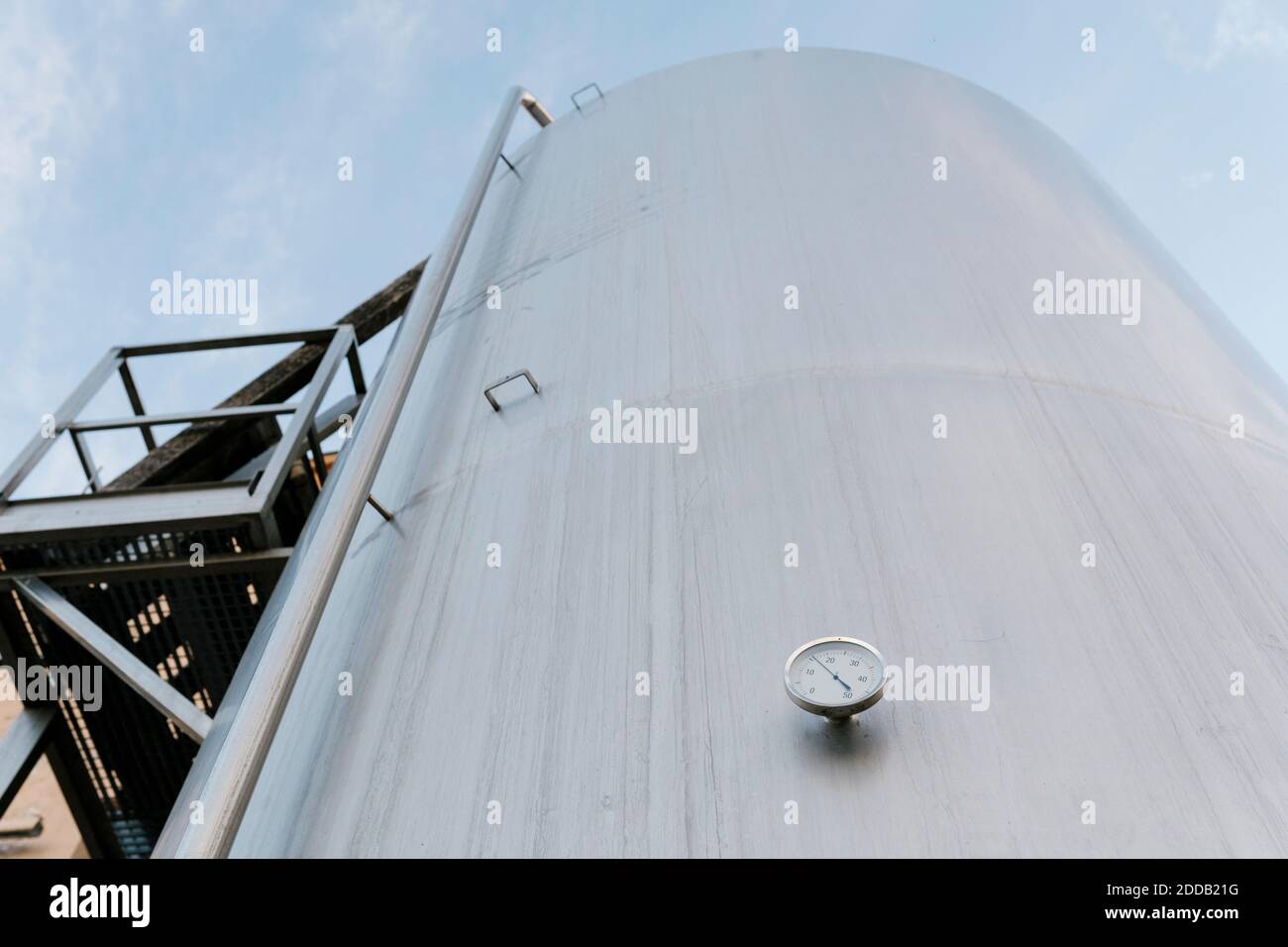Metallic distillation tank at winery against sky Stock Photo - Alamy