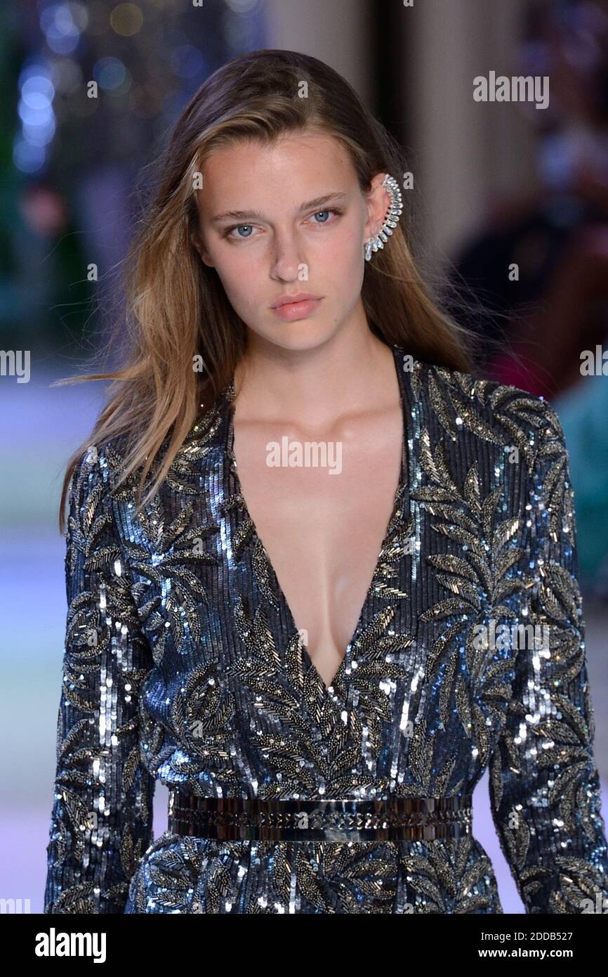 A model walks the runway during the Azzaro Haute Couture Paris Fashion ...