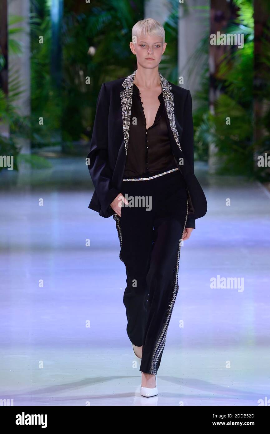 A model walks the runway during the Azzaro Haute Couture Paris Fashion ...