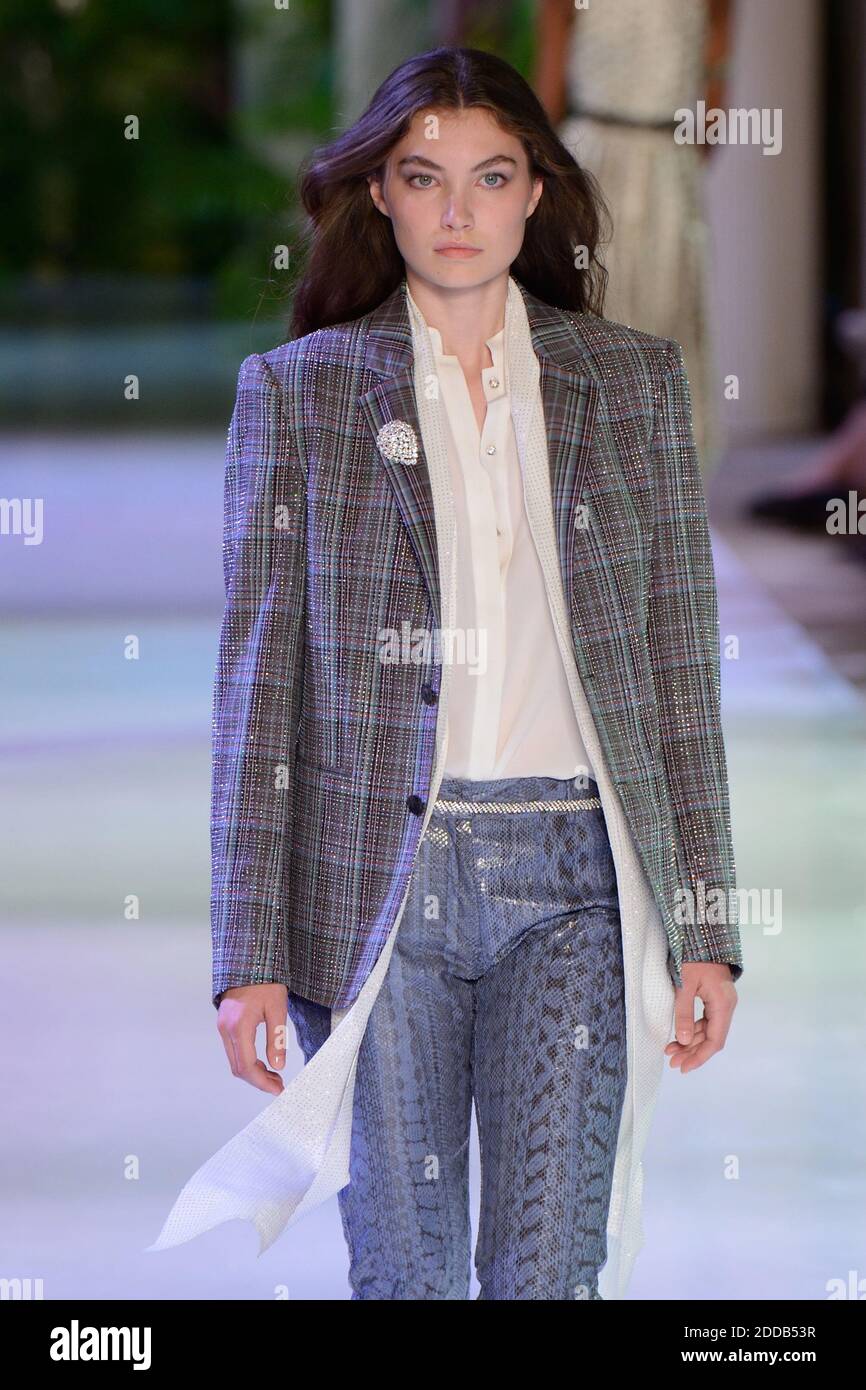 A model walks the runway during the Azzaro Haute Couture Paris Fashion ...