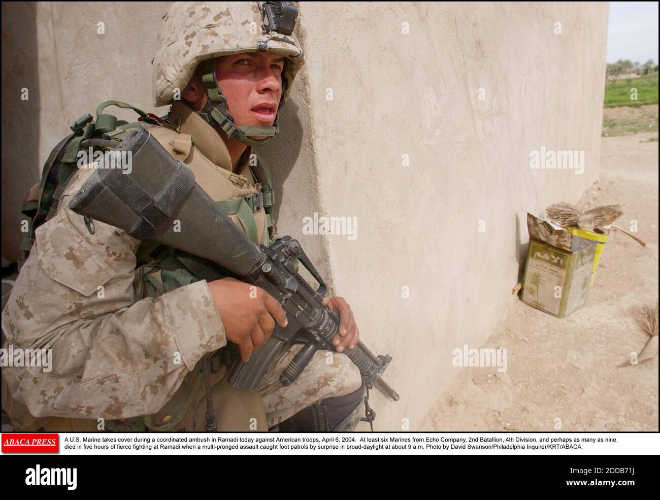 NO FILM, NO VIDEO, NO TV, NO DOCUMENTARY - A U.S. Marine takes cover ...