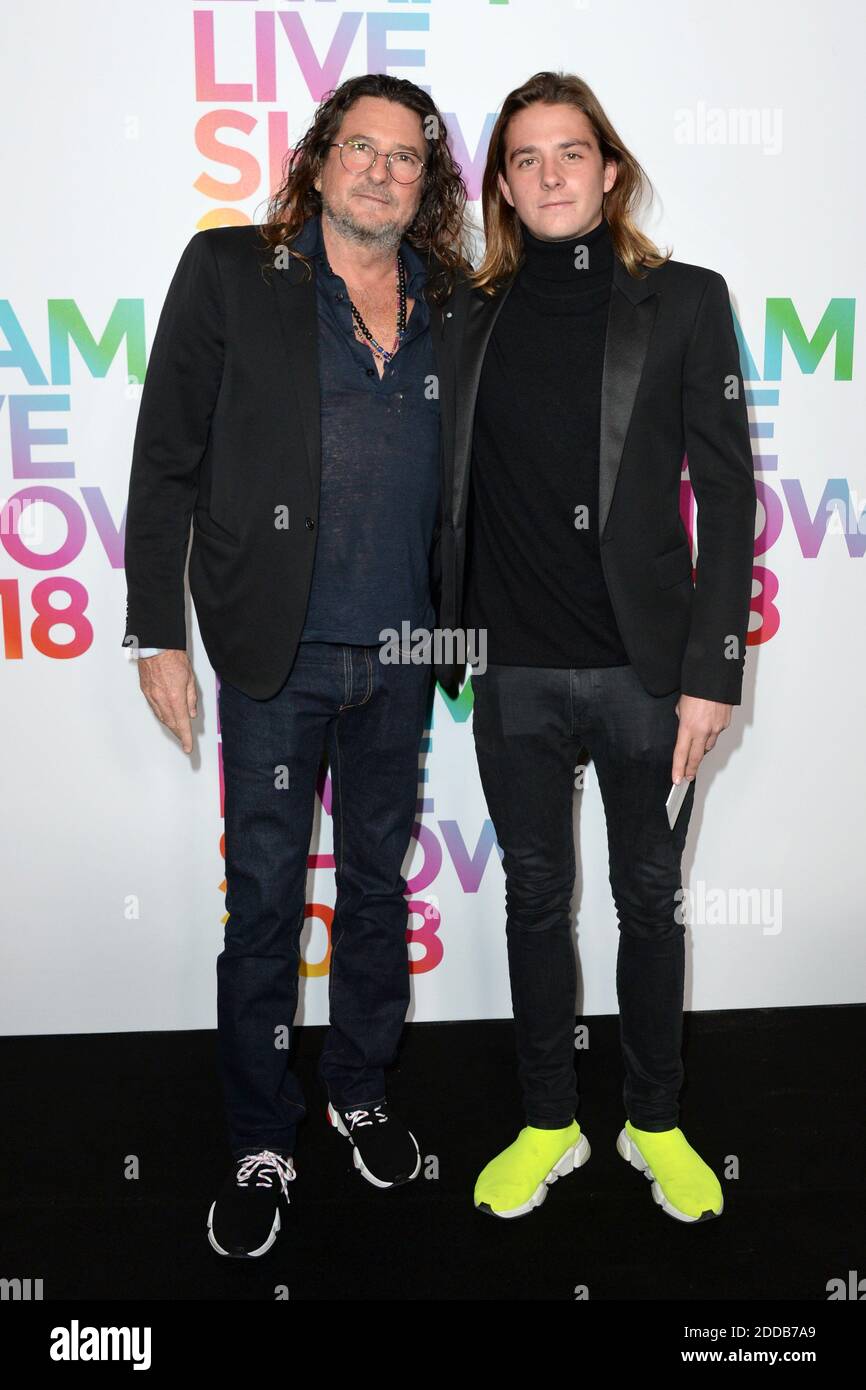 Jean-Michel Grandjean and his son attending the Etam Fashion Show as ...