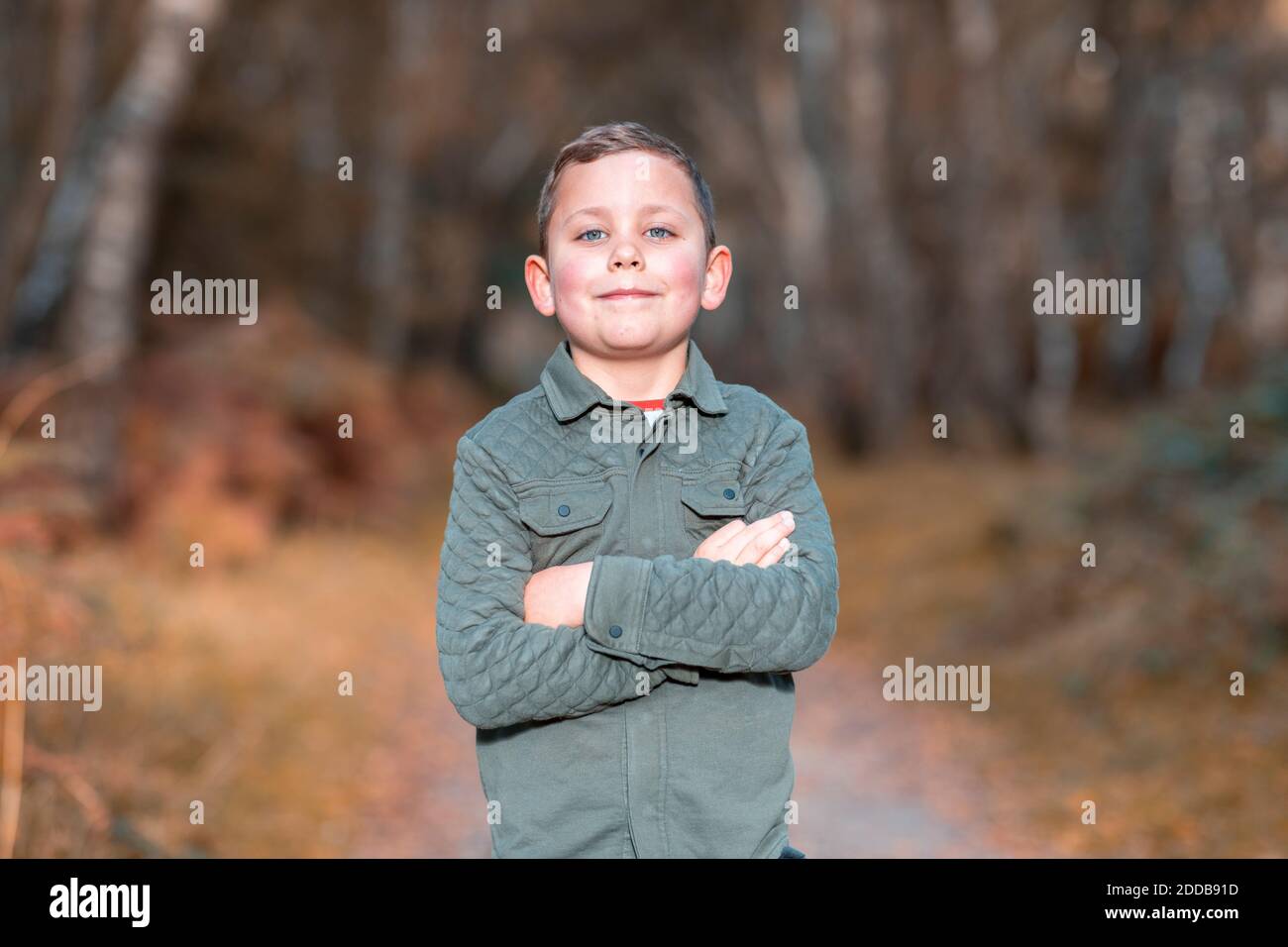 Boy with crossed arms hi-res stock photography and images - Alamy