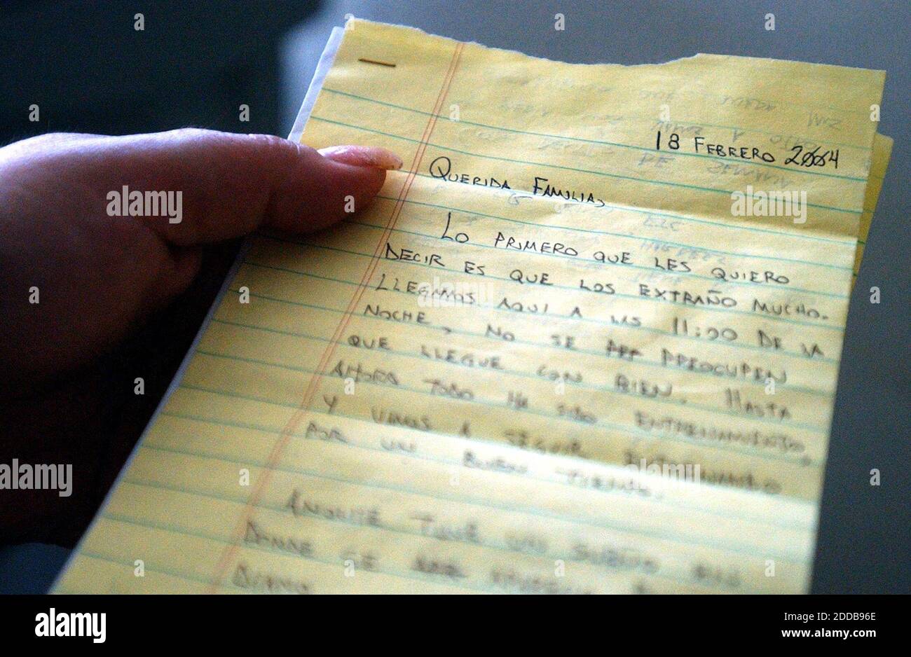 NO FILM, NO VIDEO, NO TV, NO DOCUMENTARY - Sandra Aceves holds a letter ...