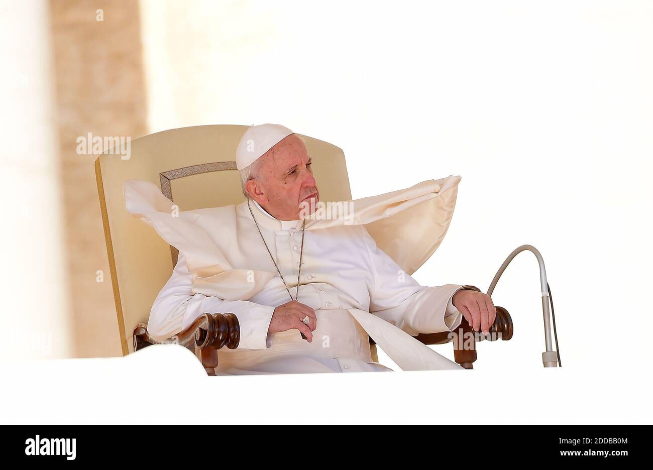 The wind blows the dress of Pope Francis as he attends the weekly ...