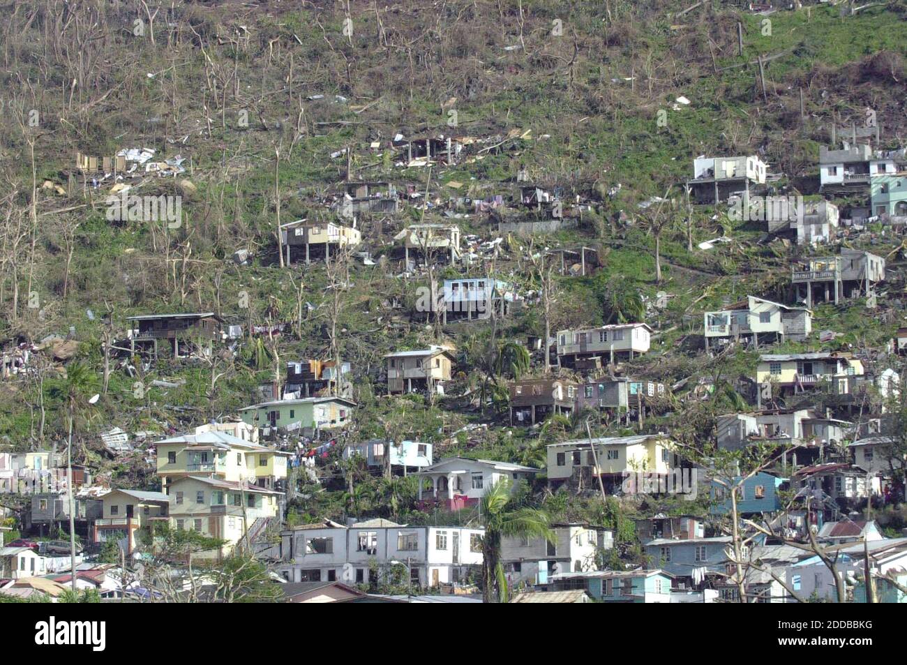 NO FILM, NO VIDEO, NO TV, NO DOCUMENTARY - Home sit wrecked on a hill ...