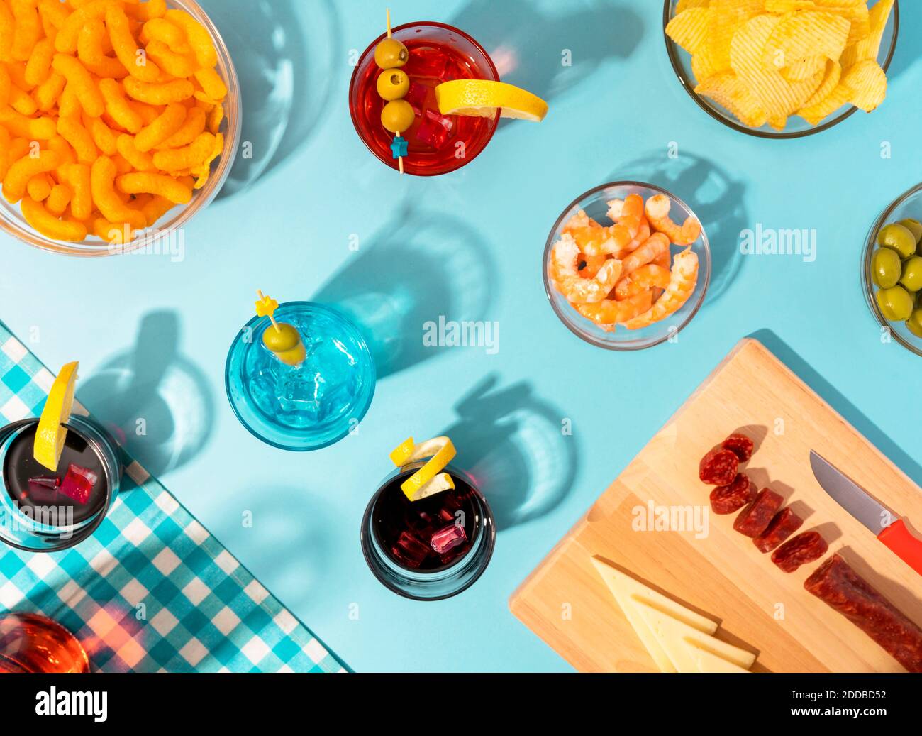 Blue table set with various snacks, appetizers and cocktails Stock ...