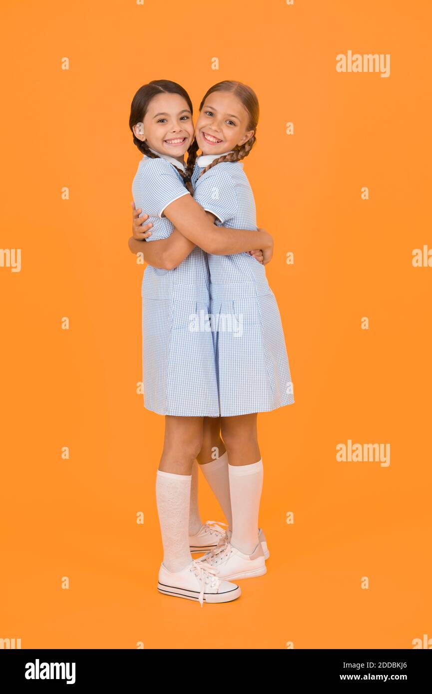 old school. kid fashion. happy friends embrace on yellow background ...
