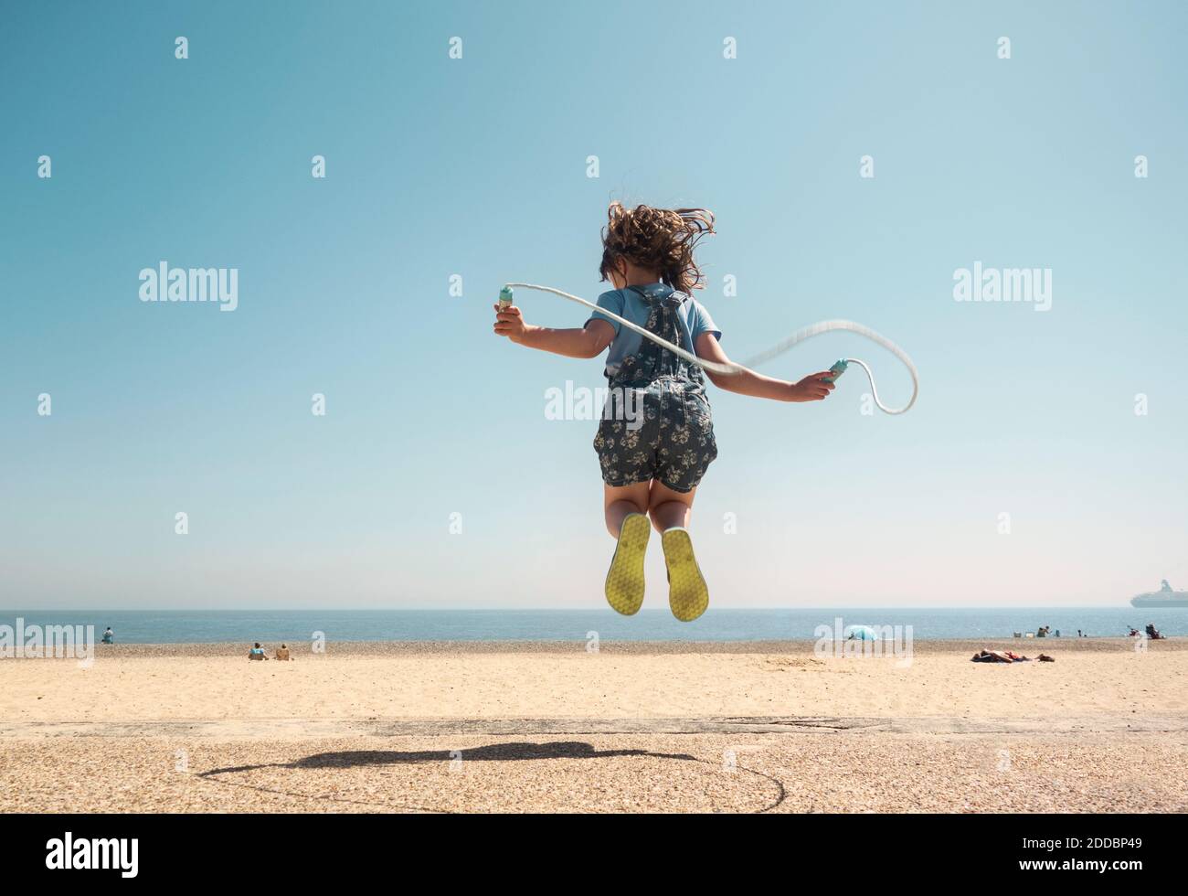 Girl jumping rope hi-res stock photography and images - Alamy