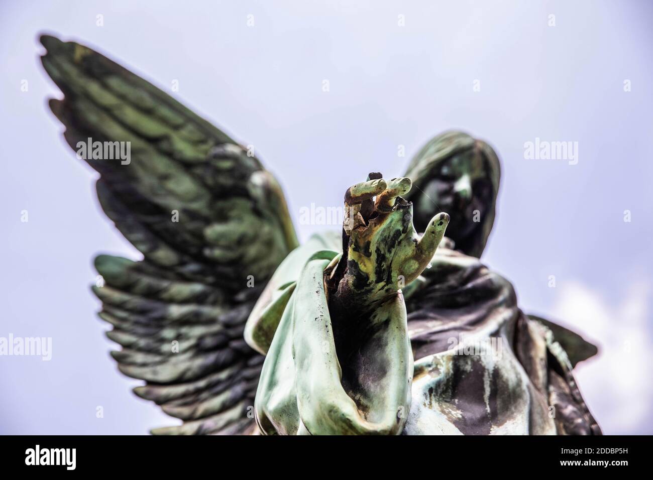 Weathered statue of angel reaching toward camera Stock Photo - Alamy