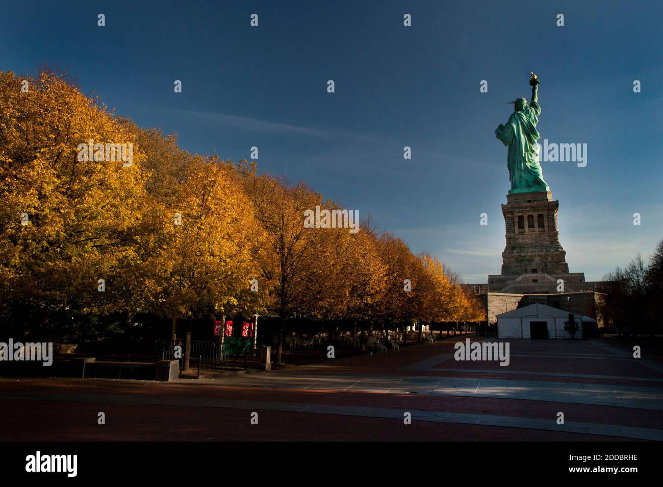 Statue of Liberty in the early morning light during the Fall season ...