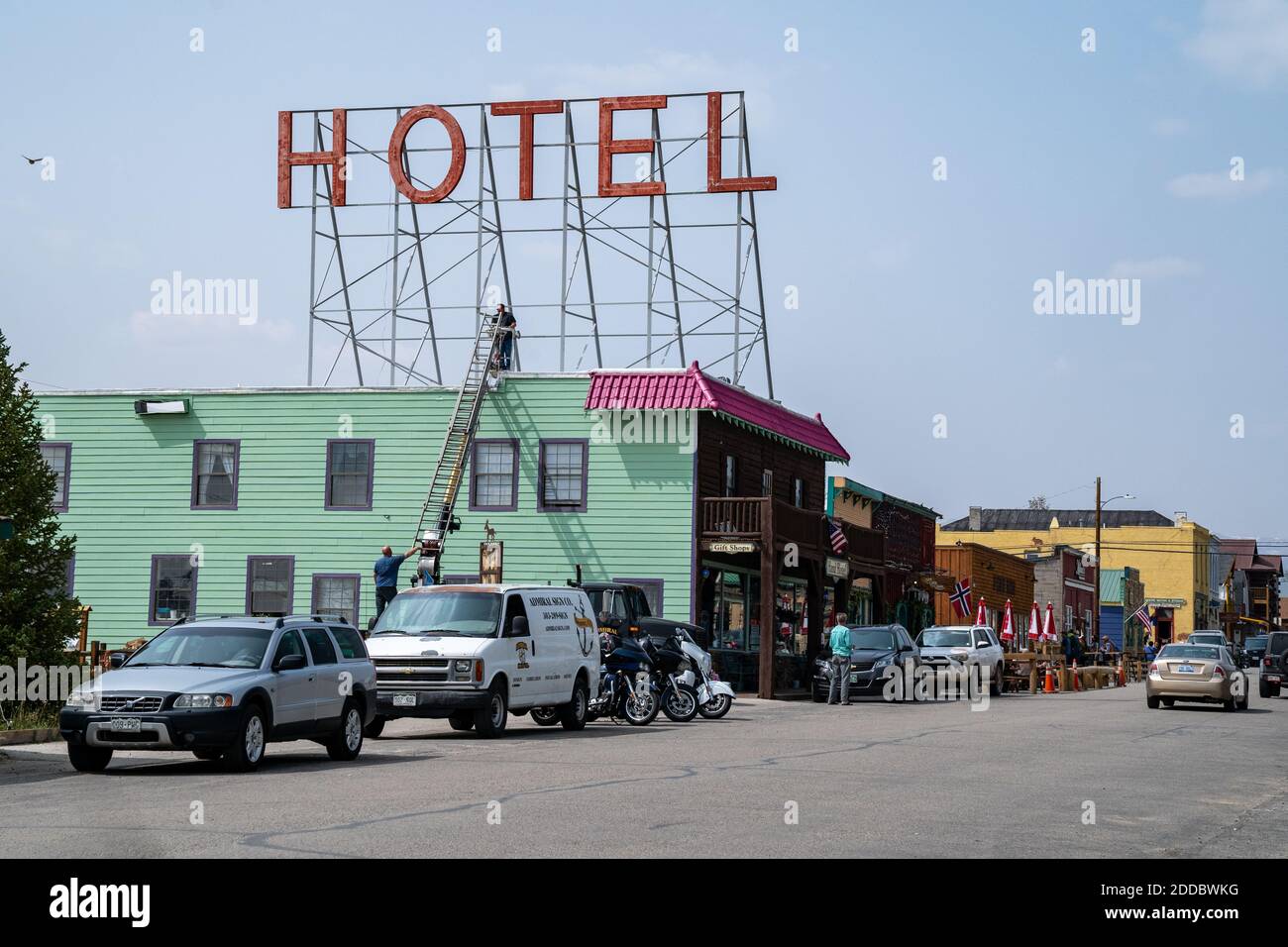 Fairplay, Colorado - September 16, 2020: Worker crew using a ladder ...