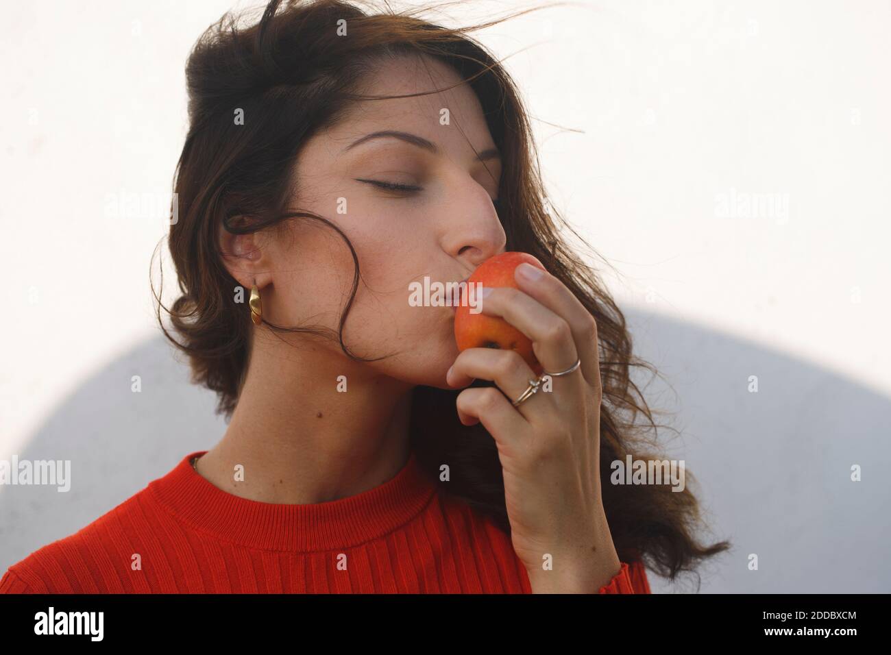Young caucasian woman kissing hi-res stock photography and images - Alamy
