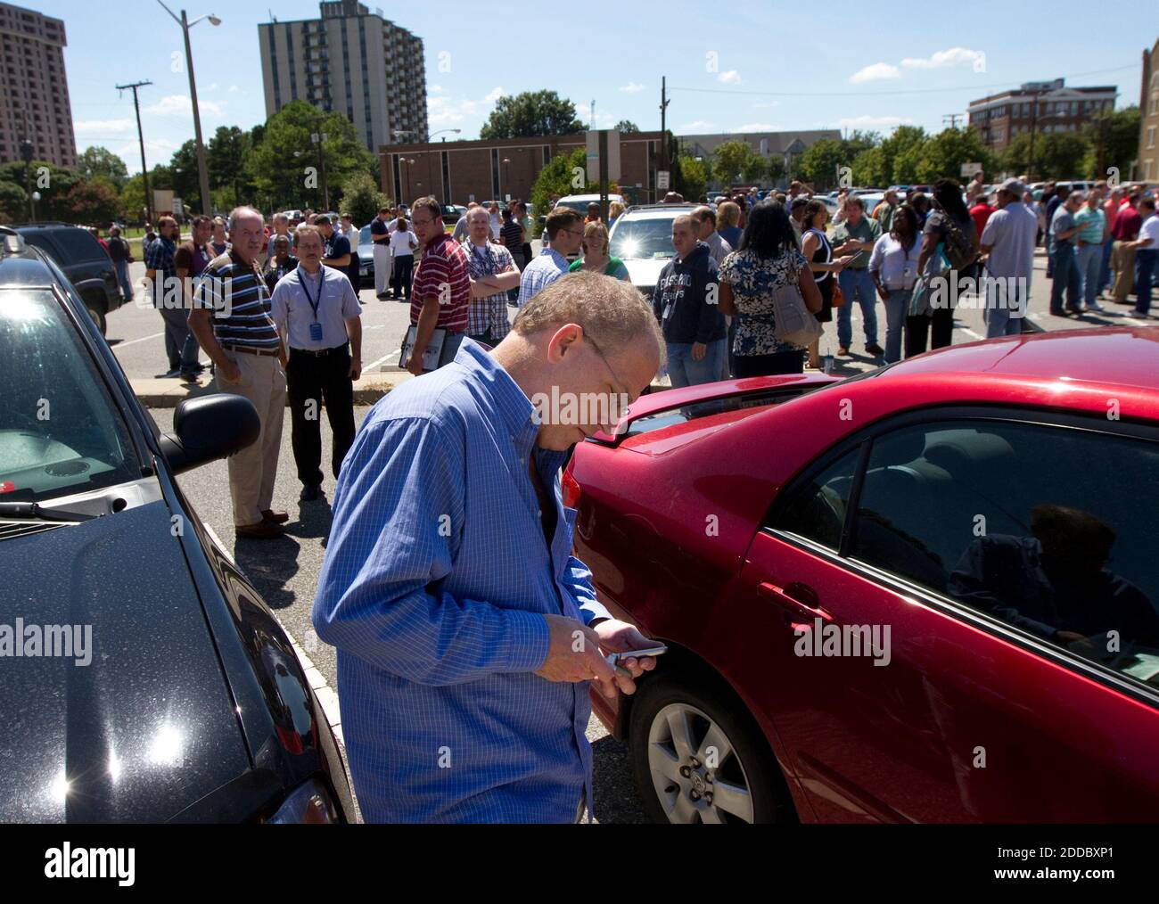 NO FILM, NO VIDEO, NO TV, NO DOCUMENTARY - Harry Pugh checks a text ...
