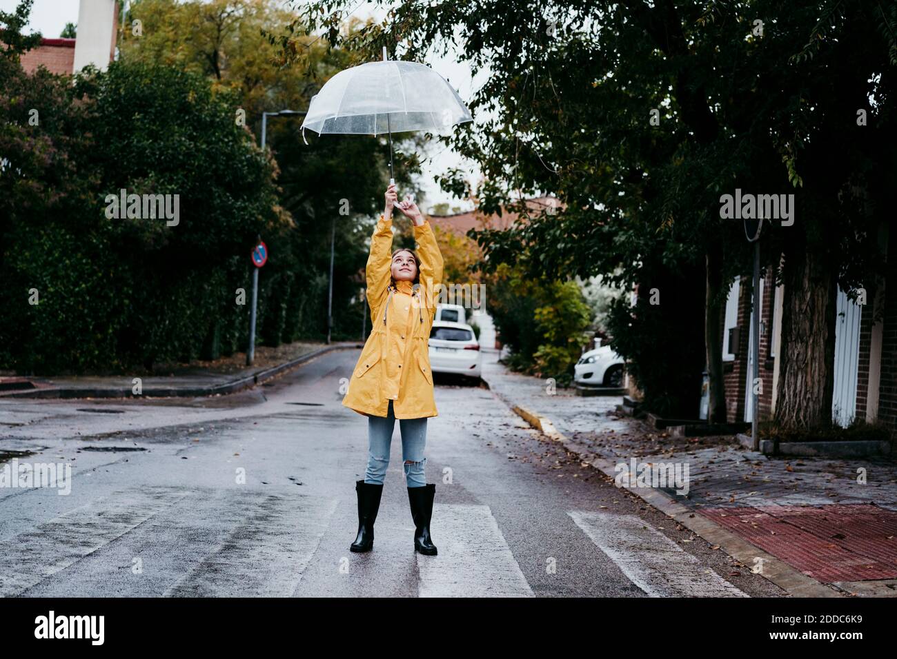 Girl wearing rain boots hi-res stock photography and images - Alamy