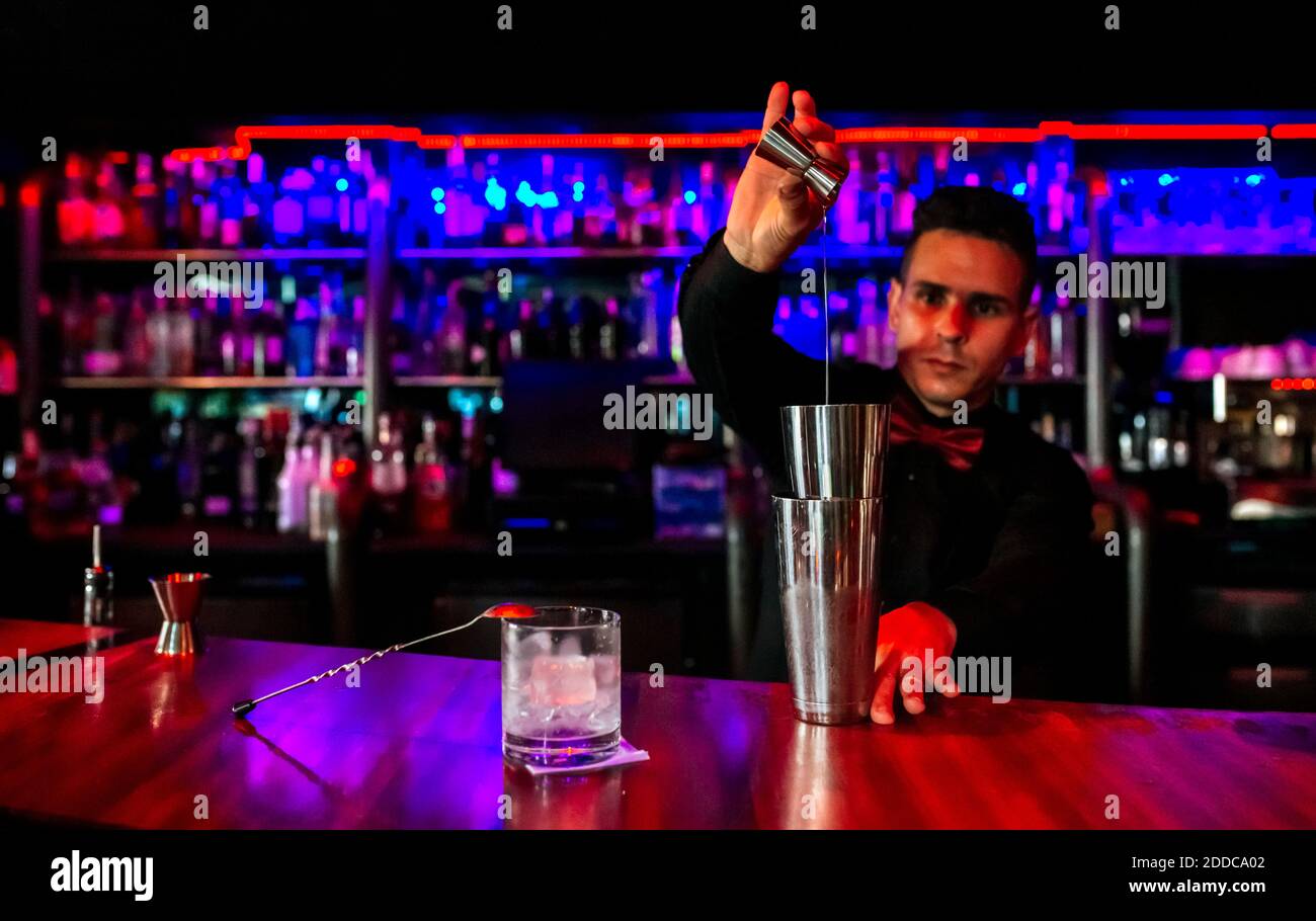 Male bartender mixing cocktail drink in glass Stock Photo - Alamy