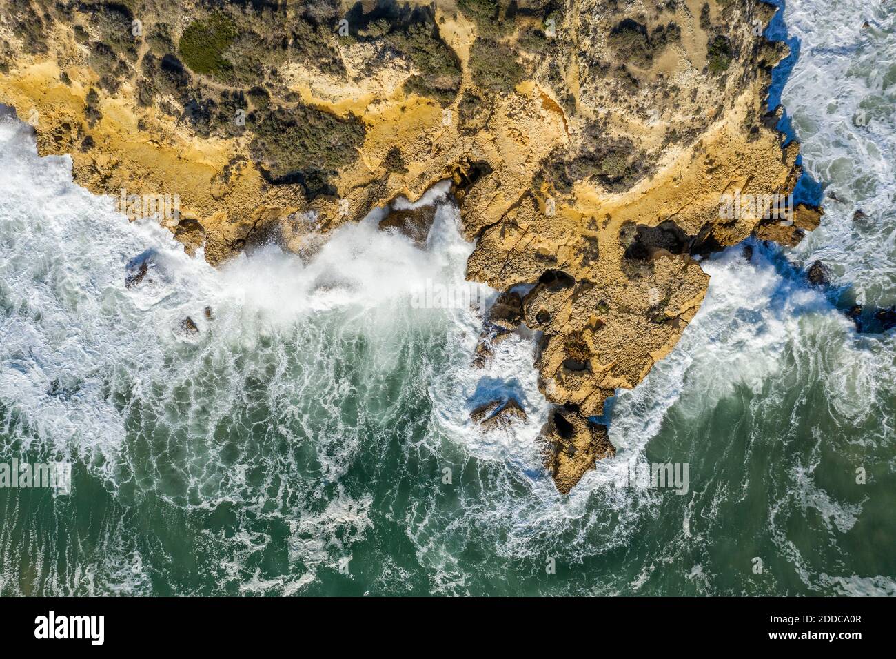 Drone view of cliffs surrounding Praia da Balbina beach Stock Photo - Alamy