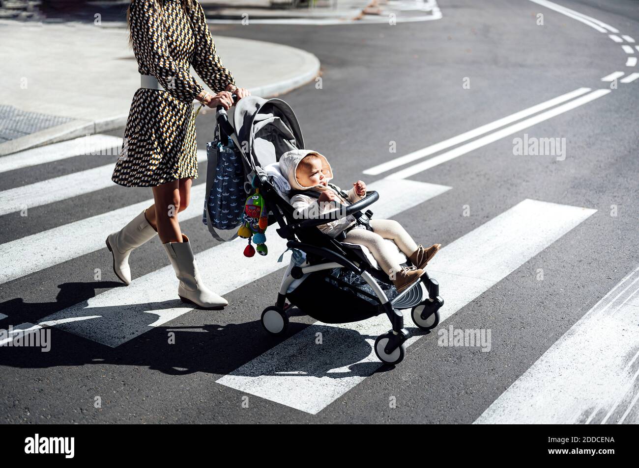 Family with stroller crossing street hi-res stock photography and ...