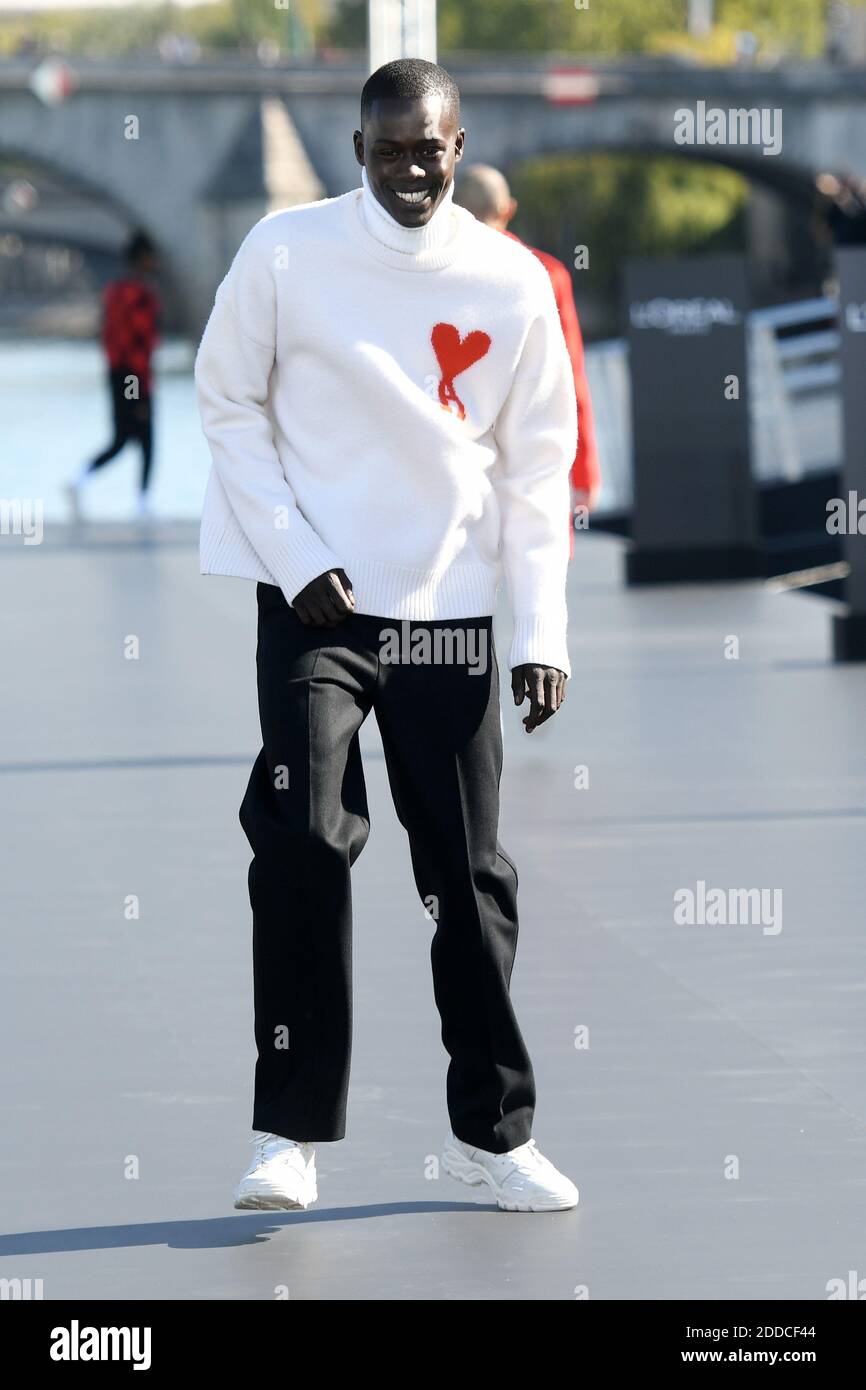 Alpha Dia walks the runway during Le Defile L'Oreal Paris as part of ...