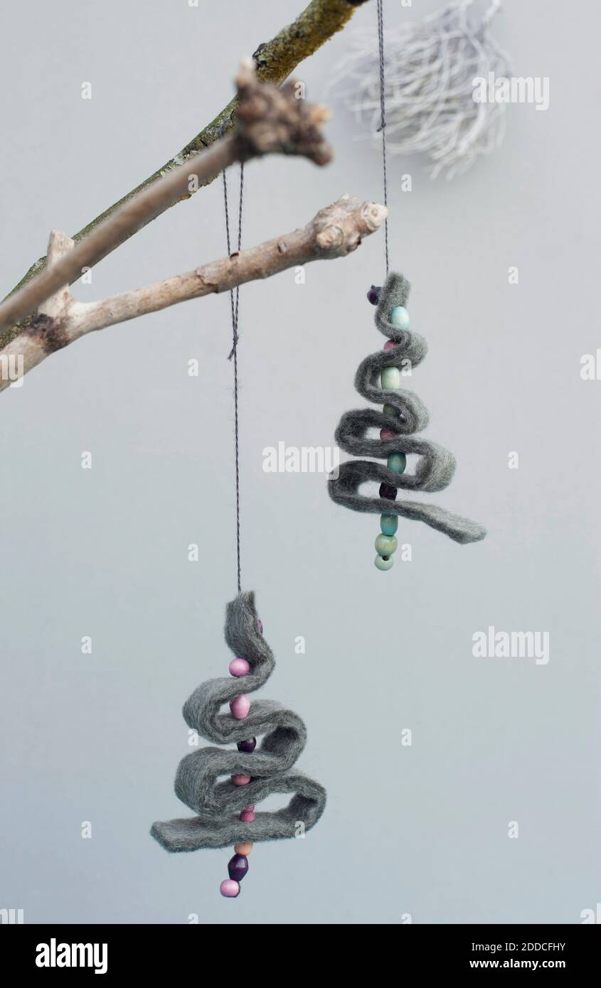 DIY Christmas decorations made of felt, strings and beads Stock Photo ...