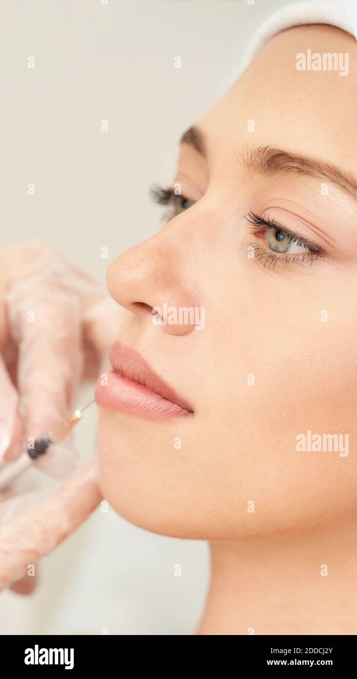 Near eye injection at spa salon. Doctor hands. Closeup. High quality ...