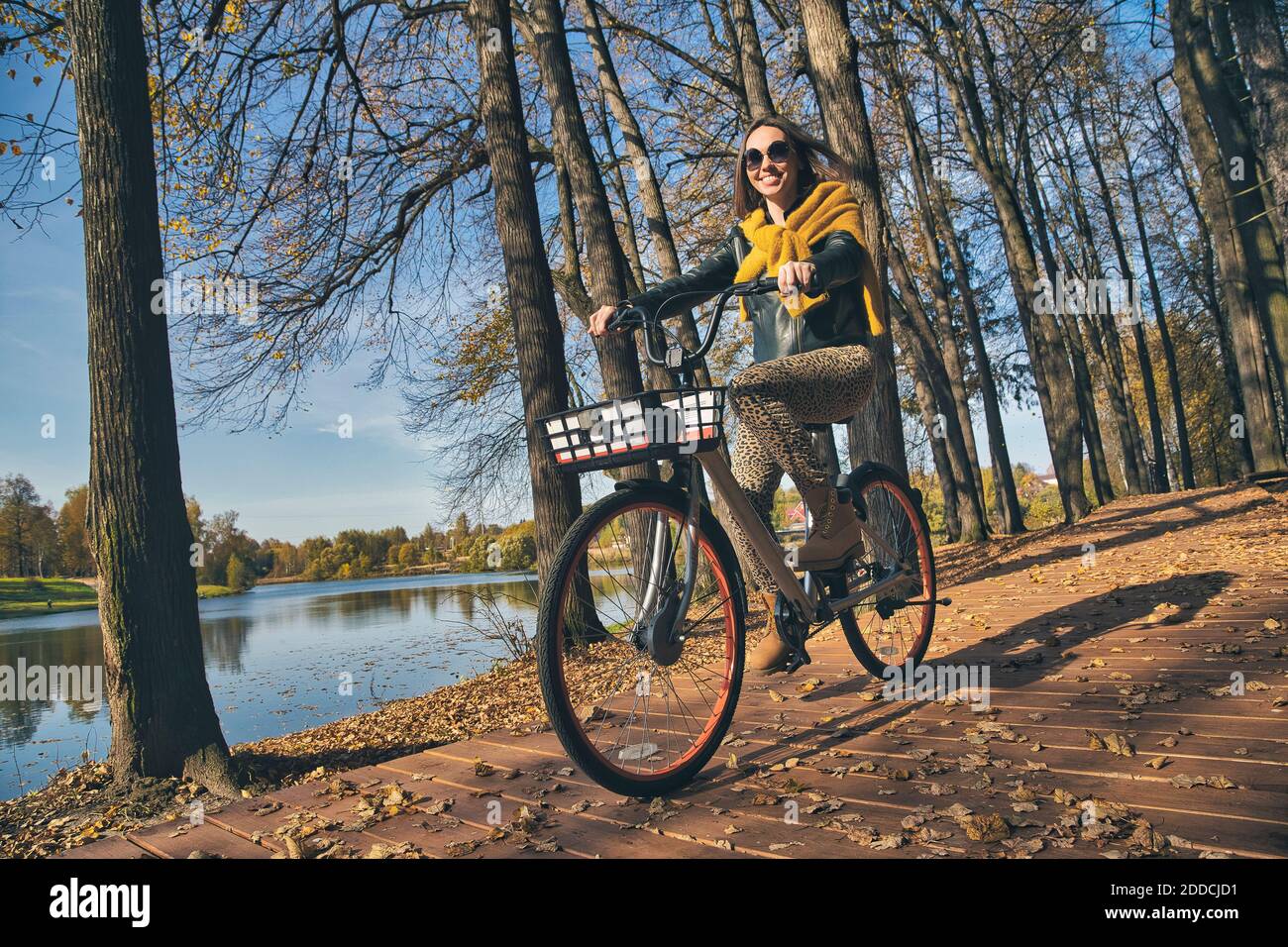 Woman riding away from camera hi-res stock photography and images - Alamy