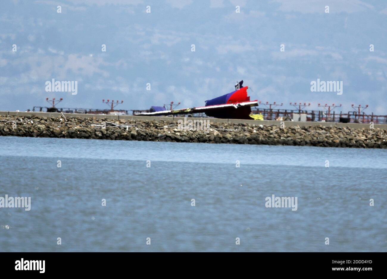 NO FILM, NO VIDEO, NO TV, NO DOCUMENTARY - The tail of Asiana Airlines ...