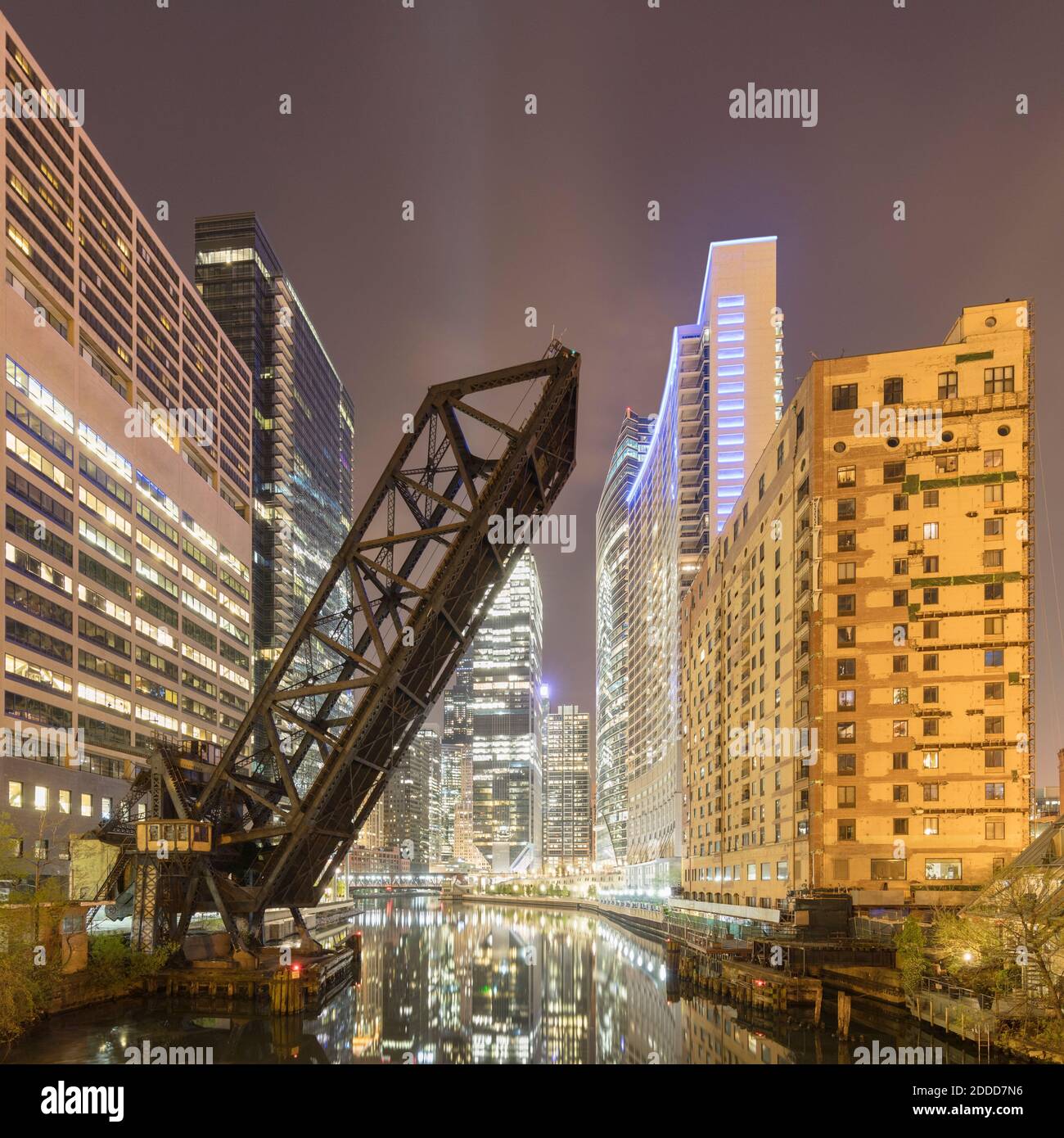 Bridge over river by buildings in city at night, Chicago, USA Stock ...