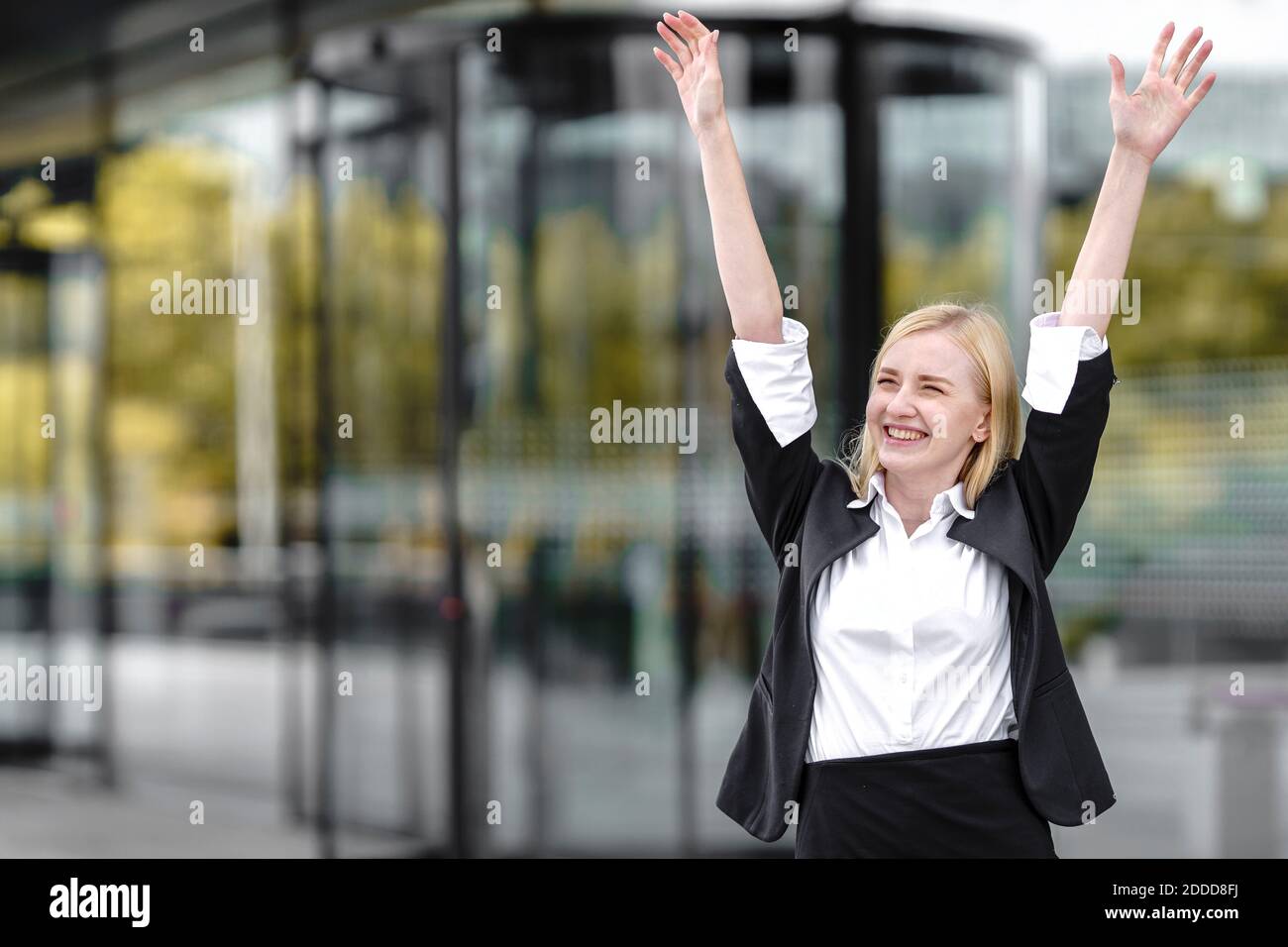 Hand raised standing cheering building exterior hi-res stock ...