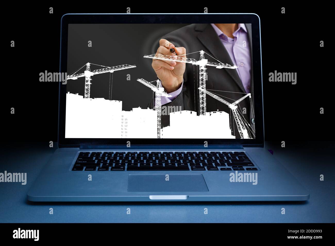 young manual worker displaying laptop over white background Stock Photo ...