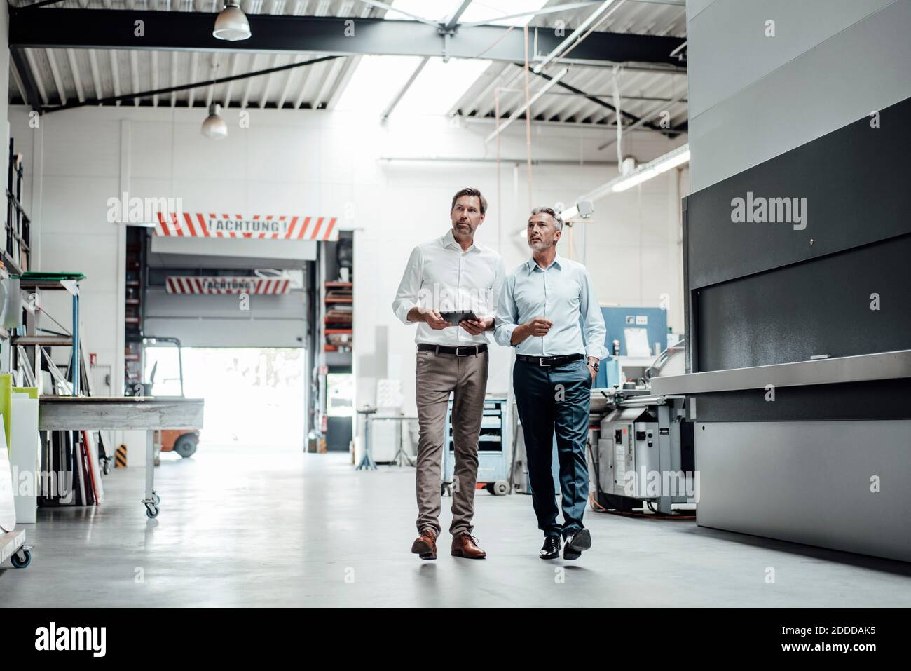 Two engineers looking at computer hi-res stock photography and images ...